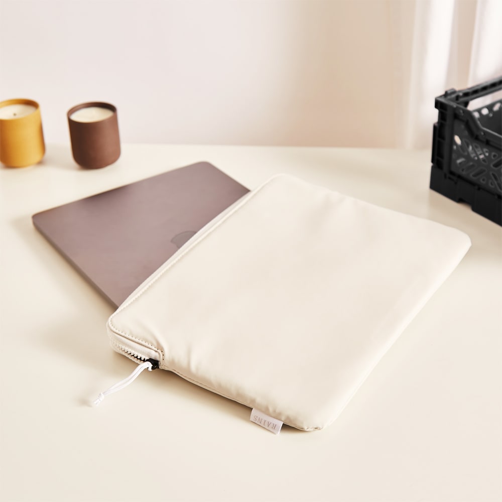 RAINS 11" Laptop Cover Off White | END.